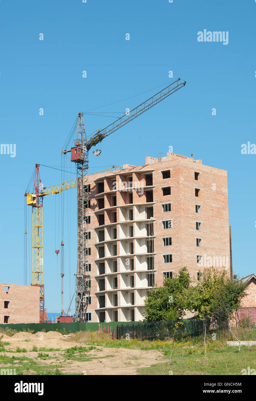 hoisting cranes and building activity Stock Photo - Alamy