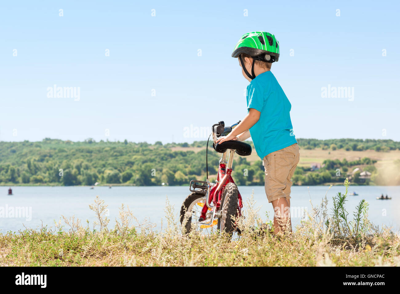 Child riding a bicycle Stock Photo - Alamy