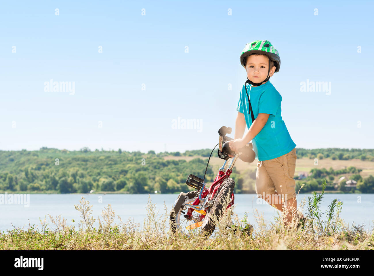 Child riding a bicycle Stock Photo - Alamy