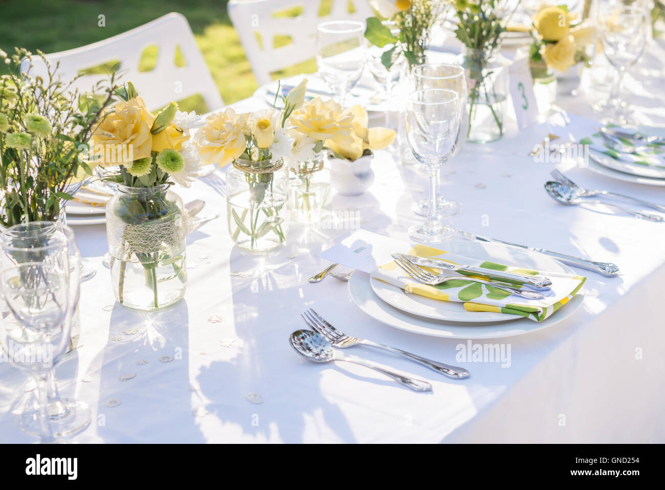 Elegance table set up white, green and yellow flowers theme, selective ...