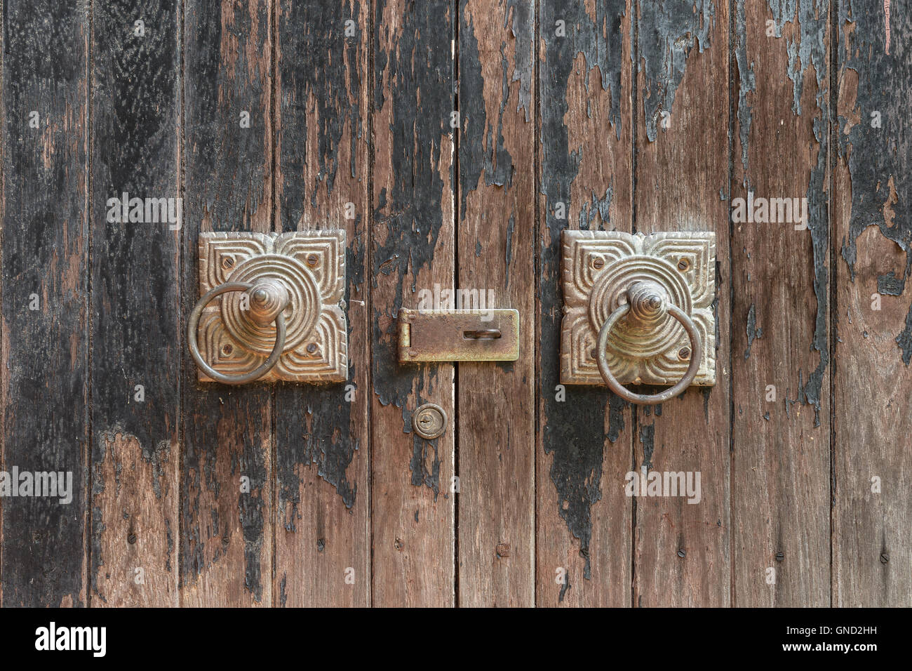Ancient wooden gate with two door knocker rings, close up Stock Photo ...