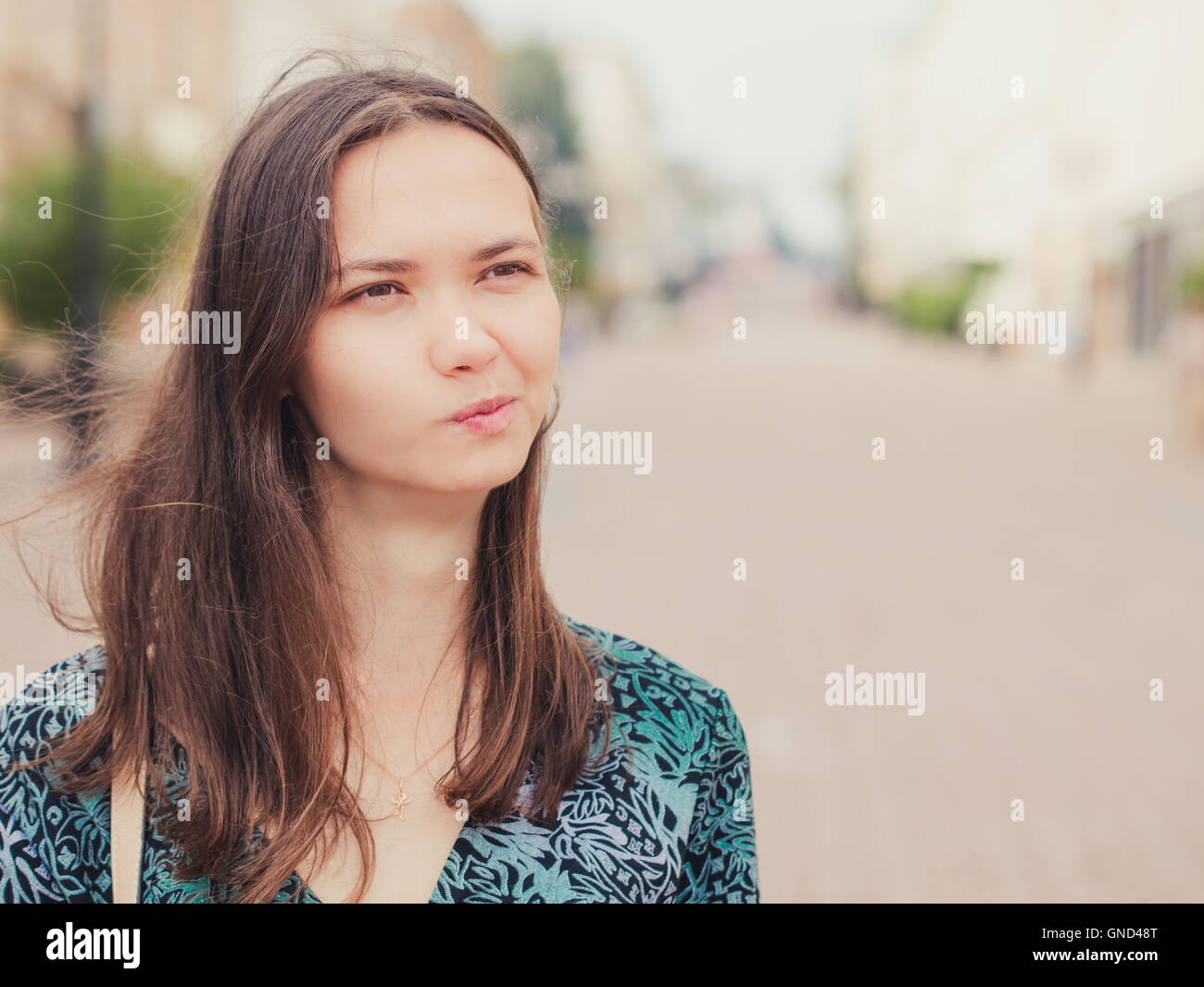 displeased handsome young woman looking away Stock Photo - Alamy
