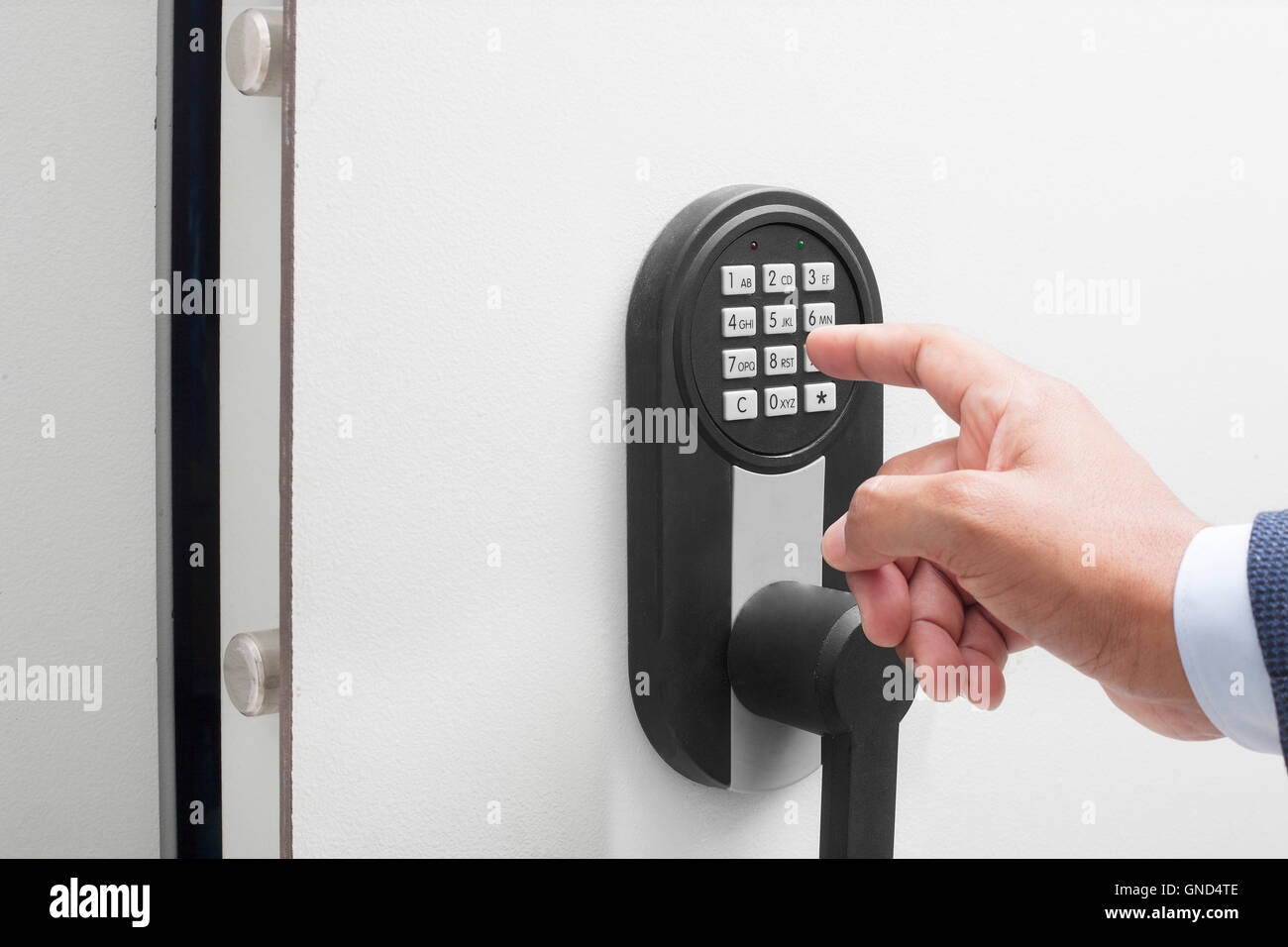 Interracial businessman hand entering security system code Stock Photo ...