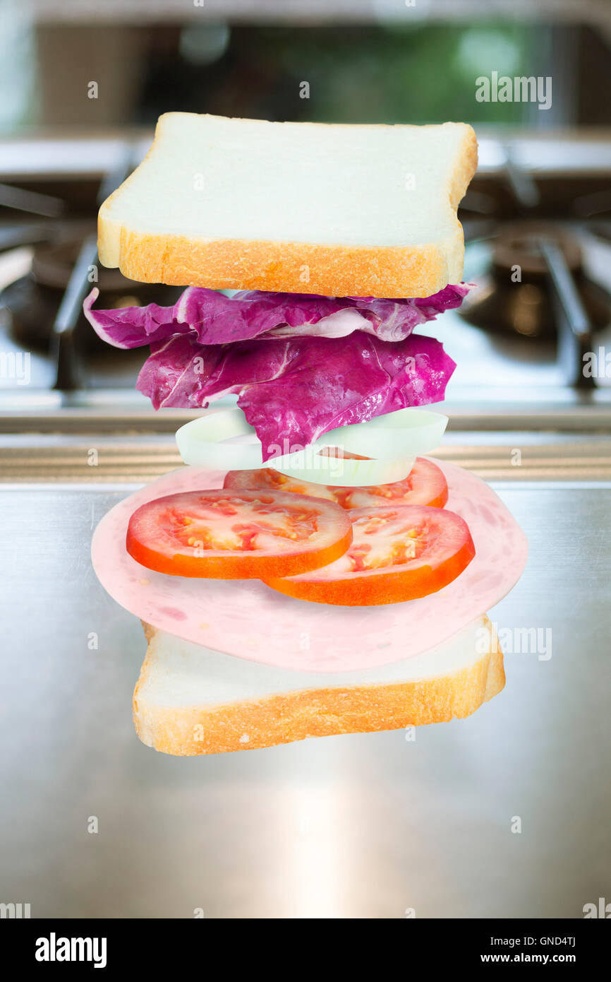 Ham sandwich with ingredients floating Stock Photo - Alamy