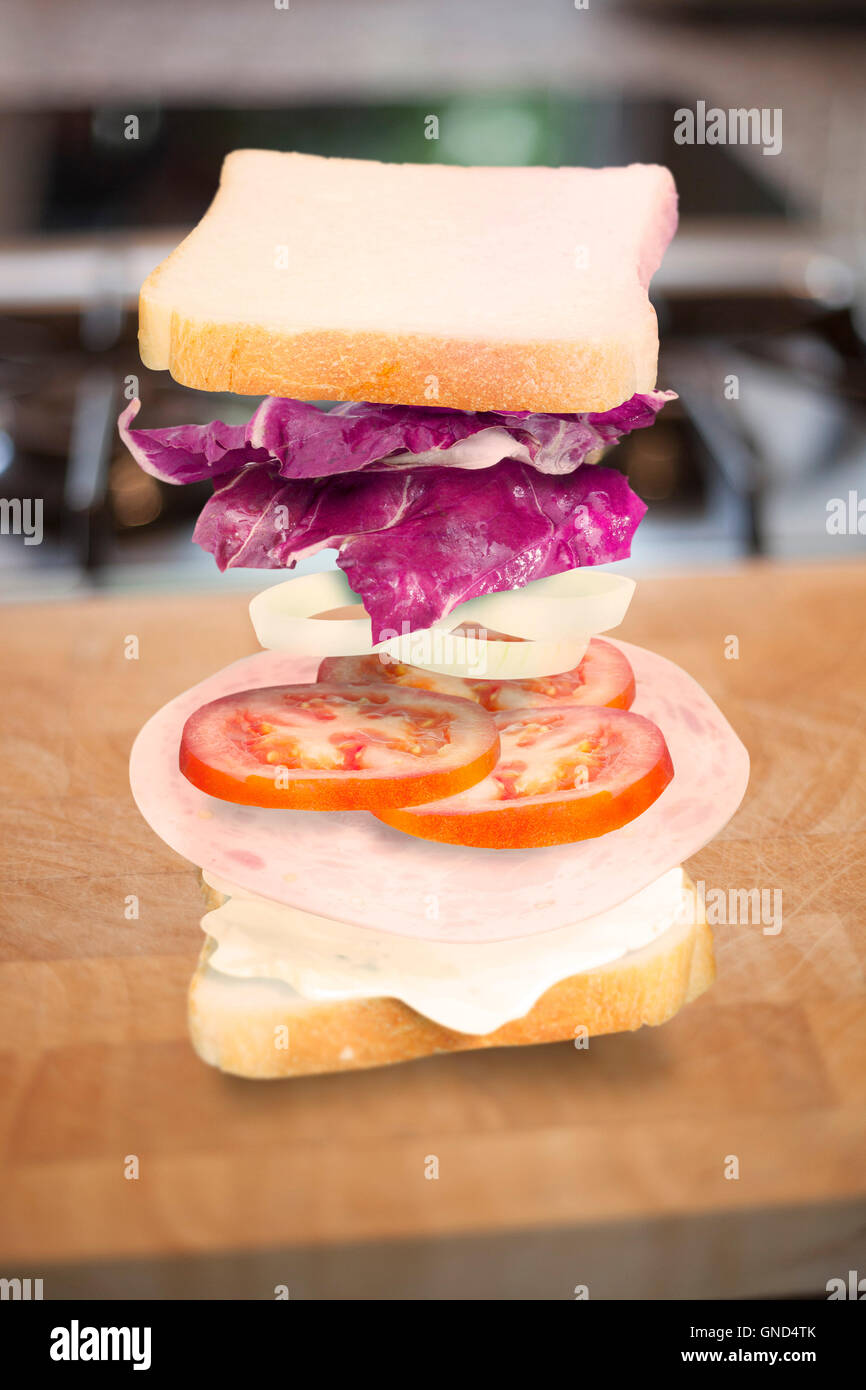Ham sandwich with ingredients floating Stock Photo - Alamy