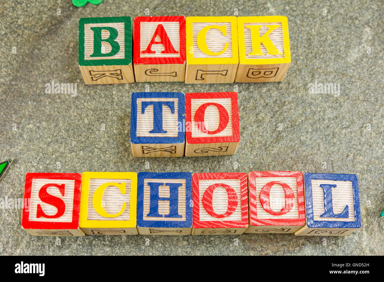 Back to school written with wooden letters on stone table Stock Photo ...