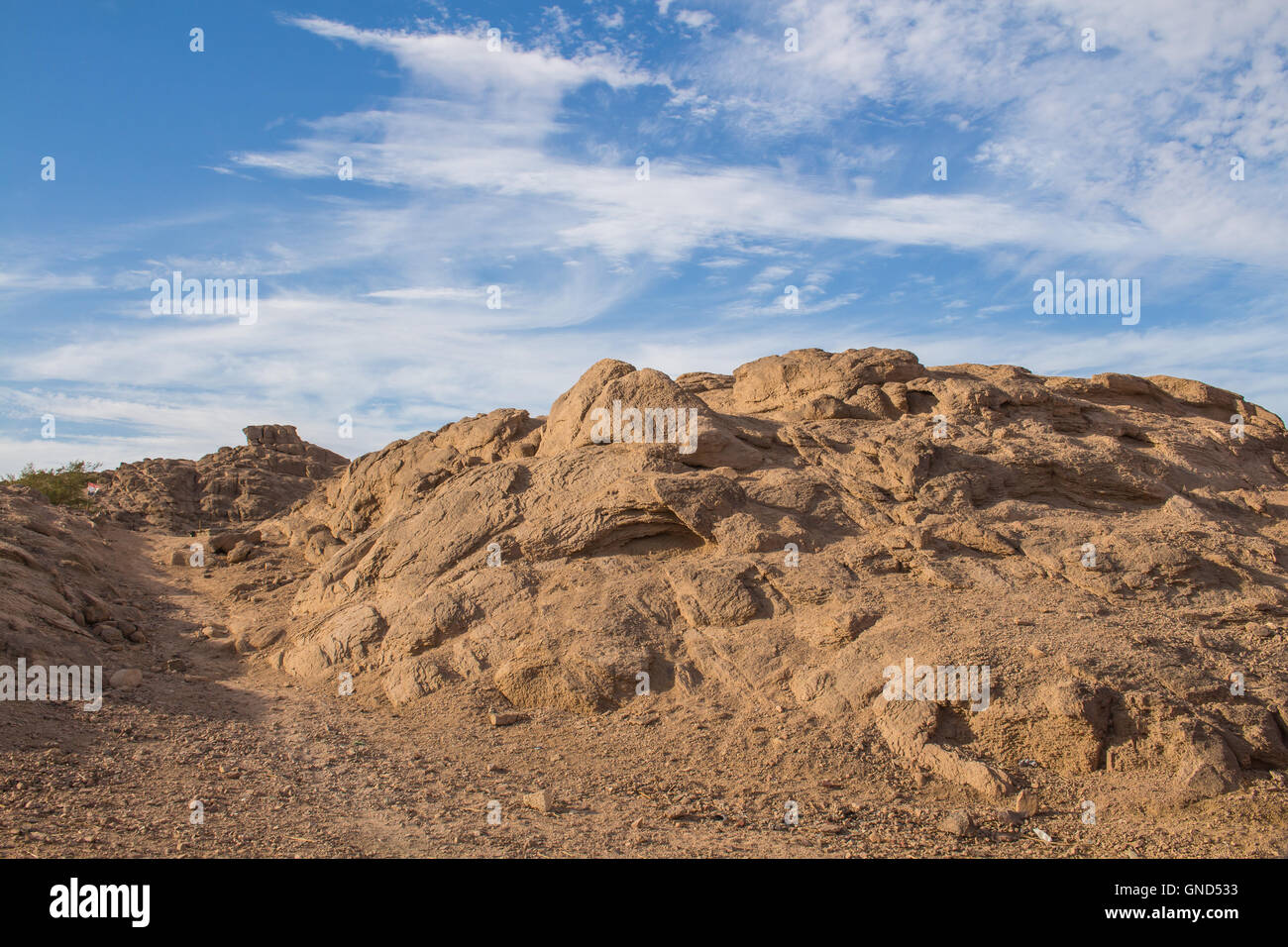 Detail of a rocky mountain in the desert in Egypt. Dark sand color, in ...