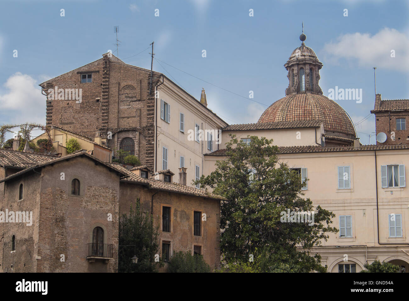 All shades of orange color of the facades of the roman houses. Dome of ...