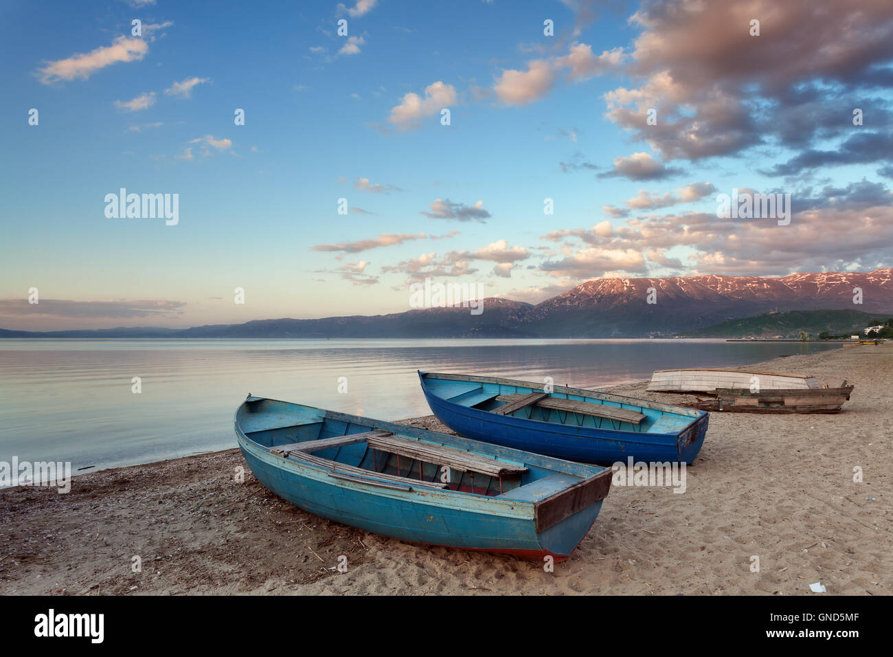 Wooden boats moored on the beach of Lake Ohrid, Pogradec, Albania Stock ...
