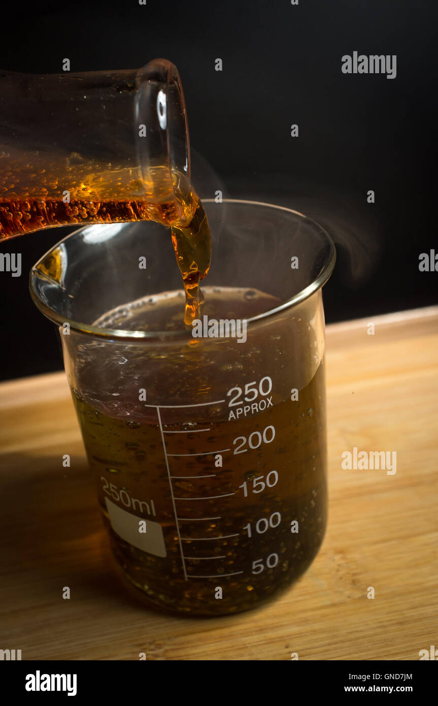 Close up glass measuring beaker for science experiment background Stock ...