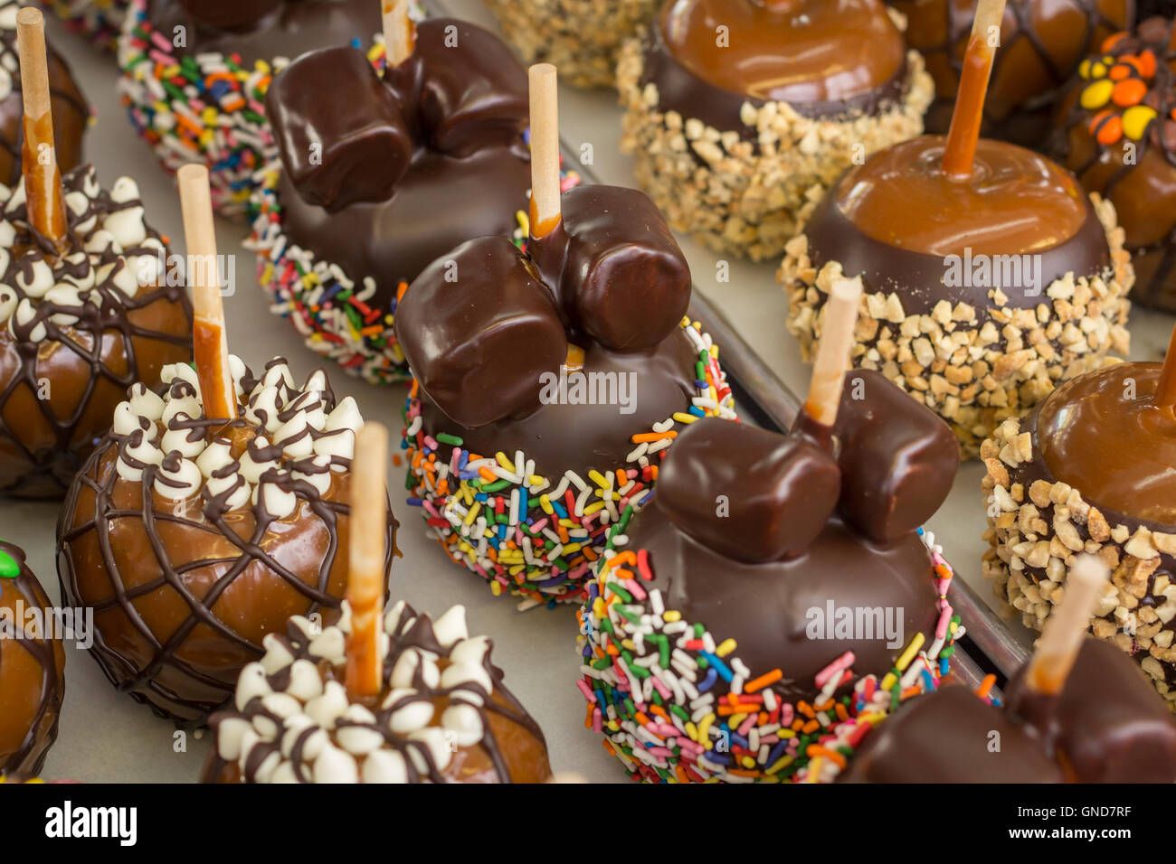 Tray of assorted variety of candy apples at state fair Stock Photo - Alamy