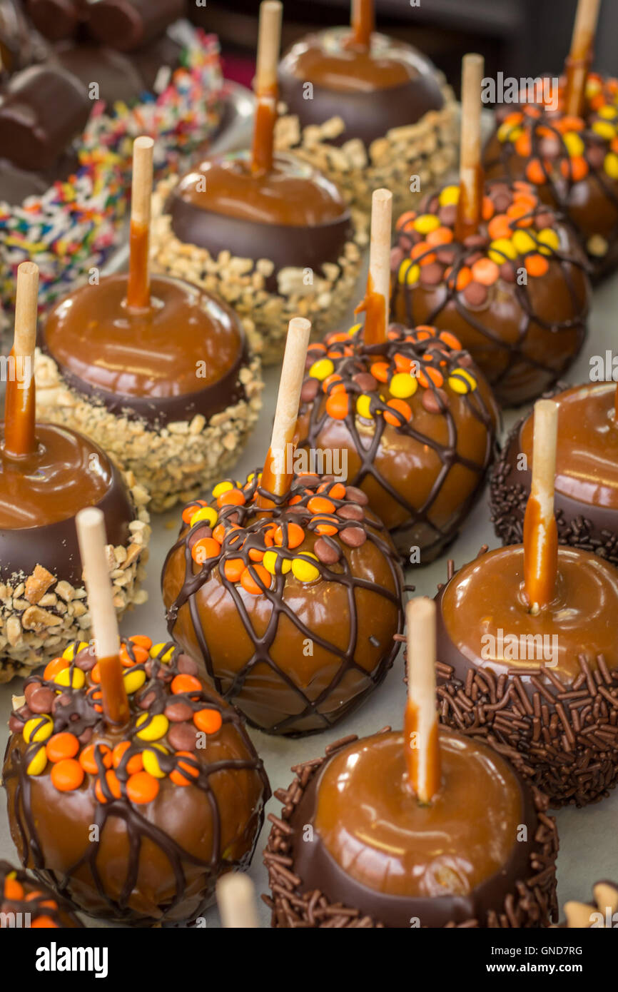 Tray of assorted variety of candy apples at state fair Stock Photo - Alamy