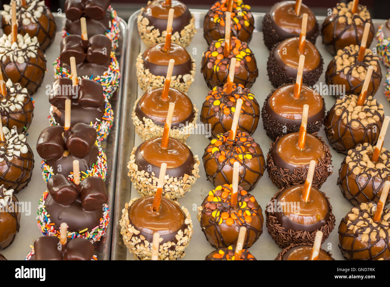 Tray of assorted variety of candy apples at state fair Stock Photo - Alamy