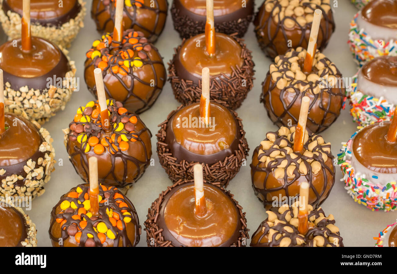 Tray of assorted variety of candy apples at state fair Stock Photo - Alamy
