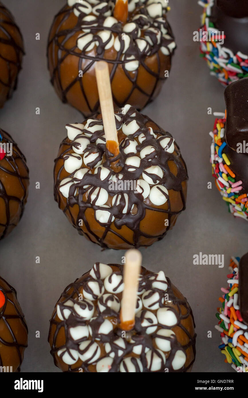 Tray of assorted variety of candy apples at state fair Stock Photo - Alamy