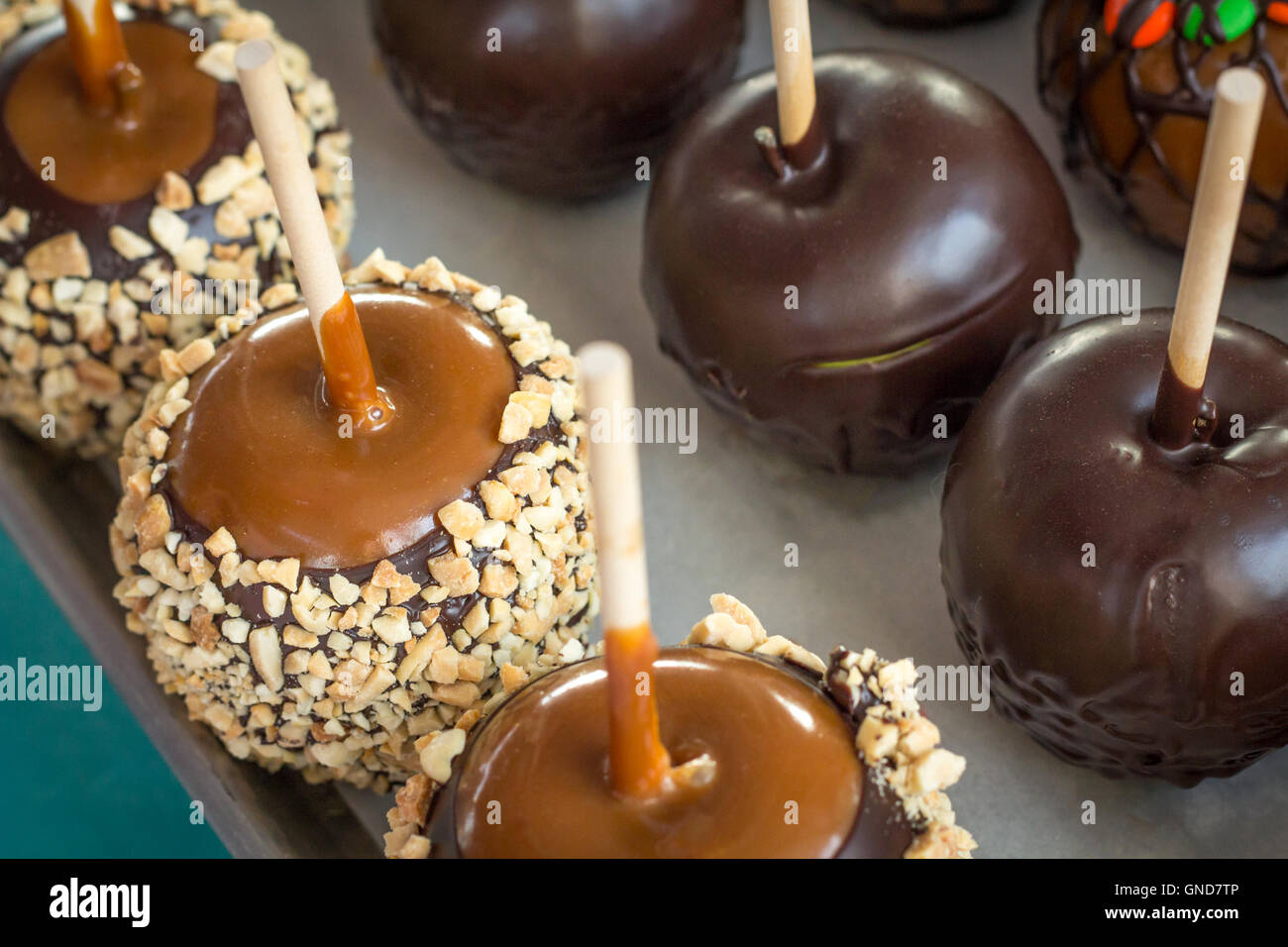 Tray of assorted variety of candy apples at state fair Stock Photo - Alamy