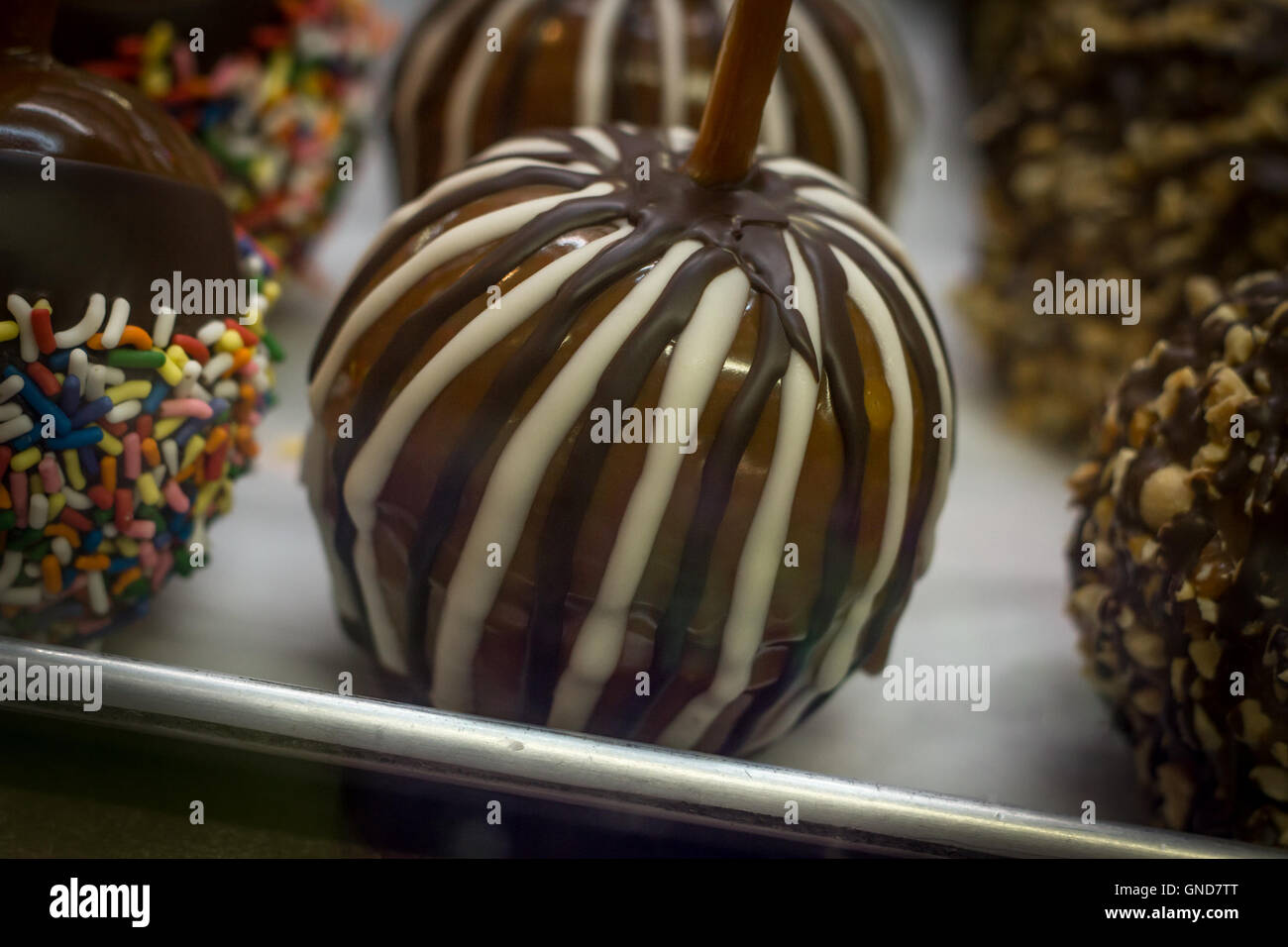 Tray of assorted variety of candy apples at state fair Stock Photo - Alamy