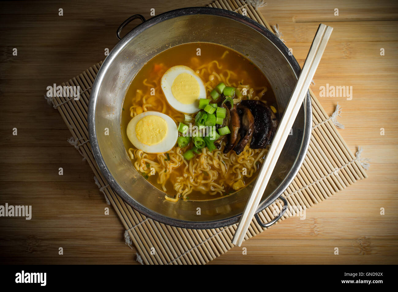 Korean cuisine ramen noodle soup with mushrooms and hard boiled eggs ...