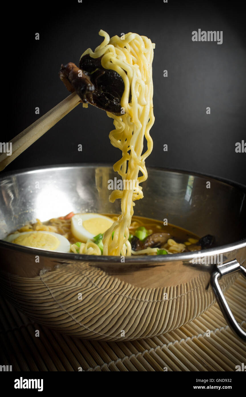 Korean cuisine ramen noodle soup with mushrooms and hard boiled eggs ...