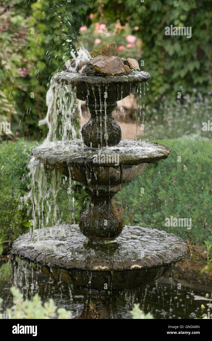 Tiered fountain in garden at Earnley Butterflies Birds and Beasts Stock ...
