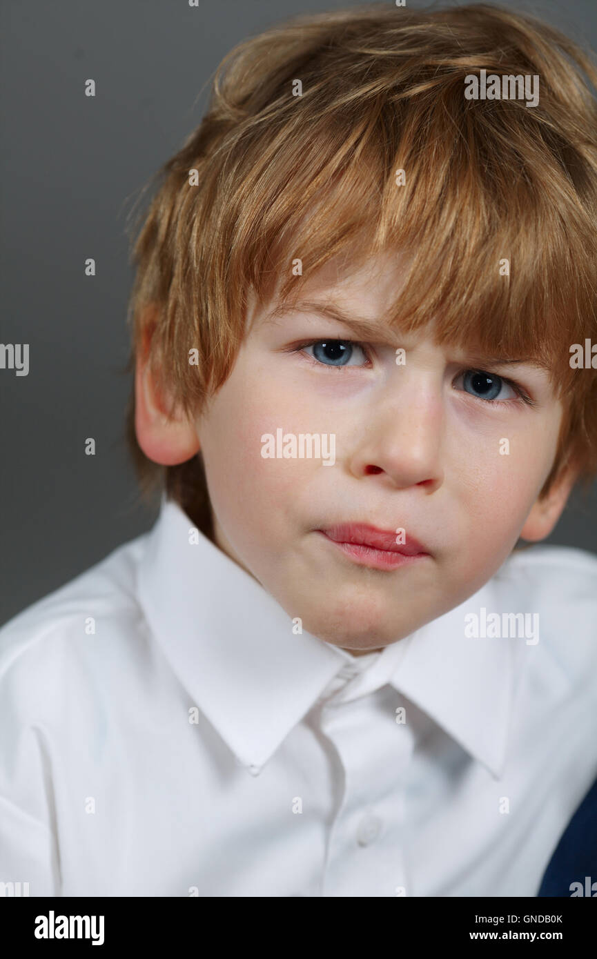 little serious boy portrait on dark Stock Photo - Alamy
