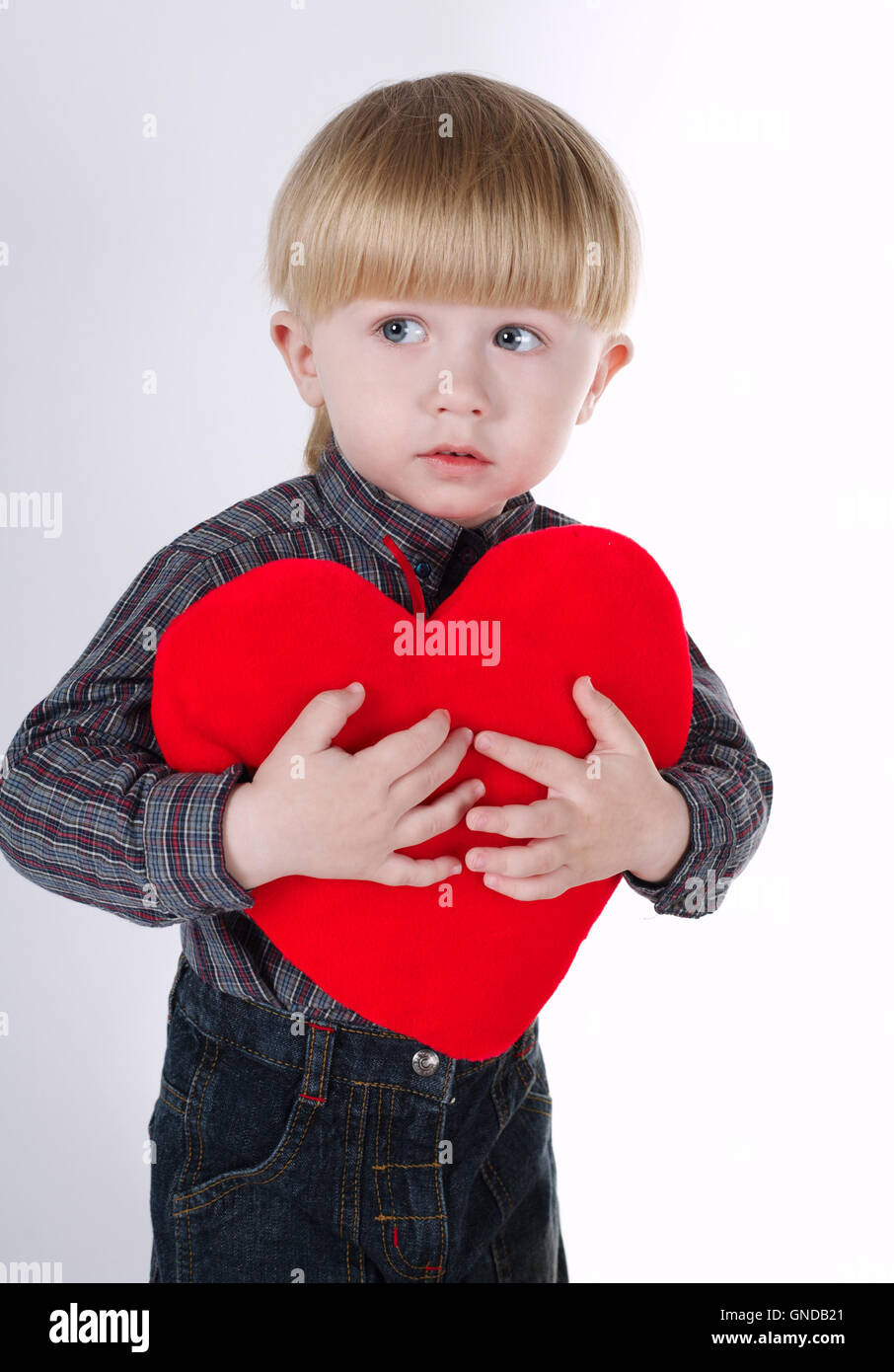 little boy holds heart isolated on white Stock Photo - Alamy