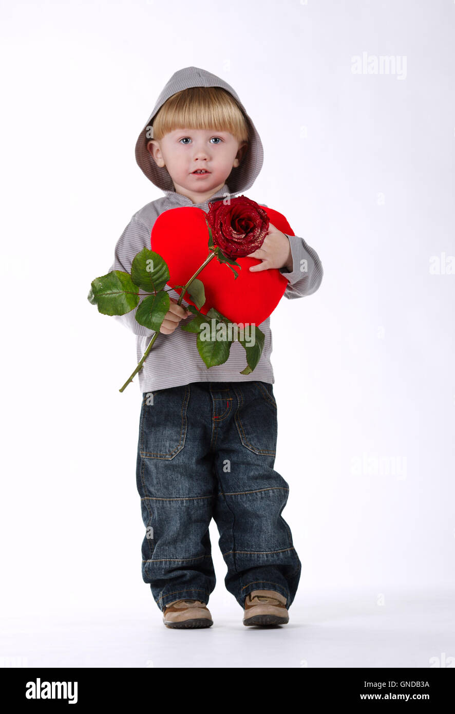 little boy with rose and heart Stock Photo - Alamy