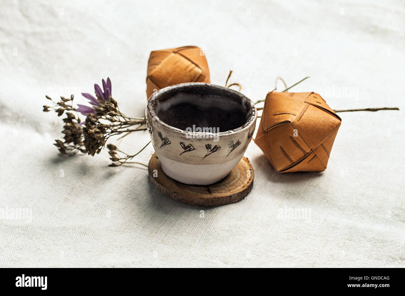 Clay pot and small wooden boxes placed on linen Stock Photo - Alamy