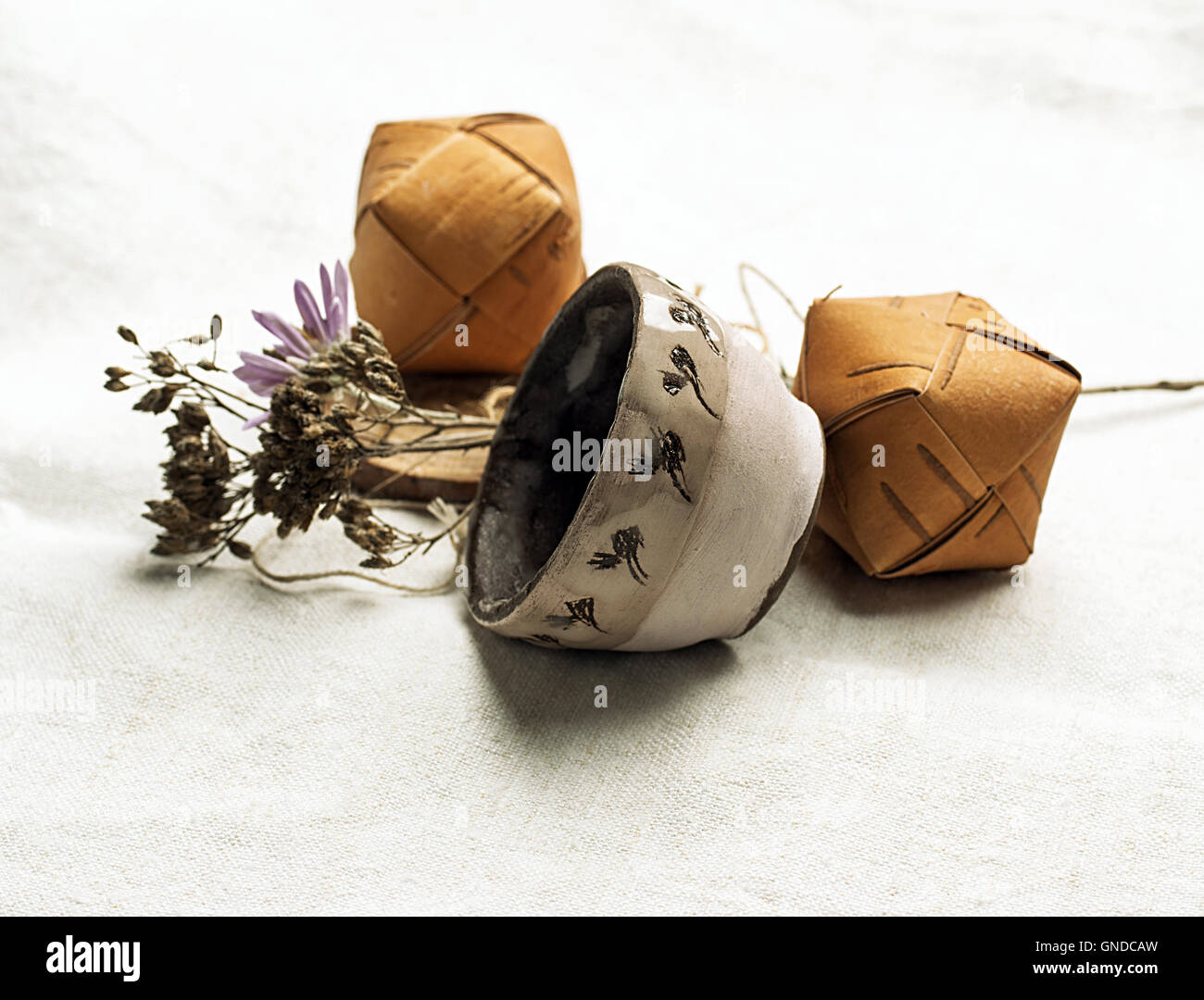 Clay pot and small wooden boxes placed on linen Stock Photo - Alamy