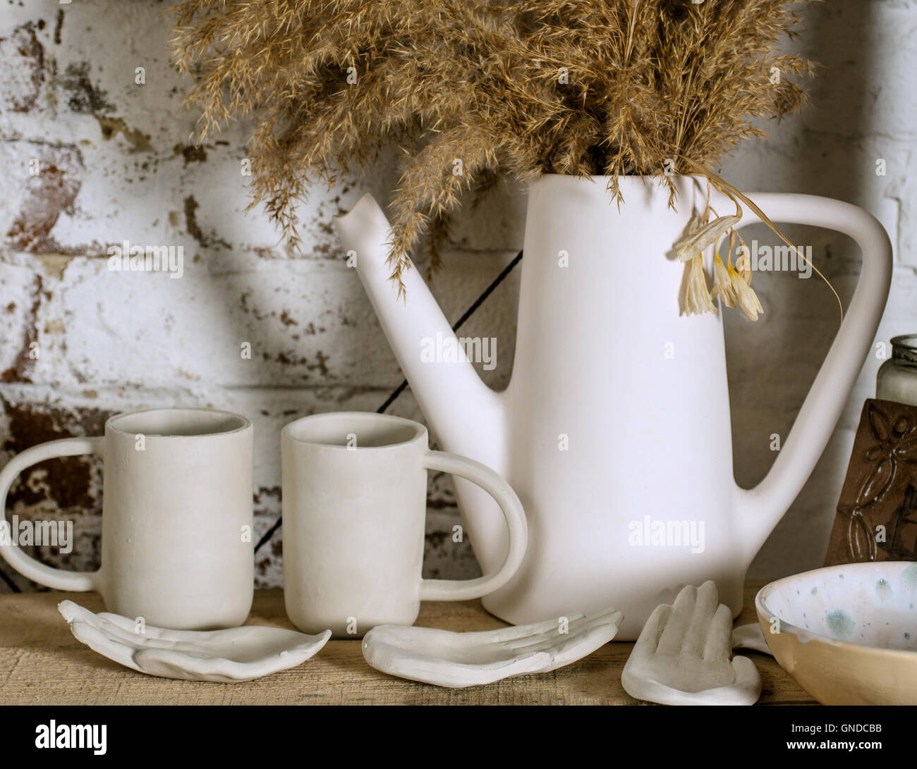 Objects made of clay prepared for burning Stock Photo - Alamy