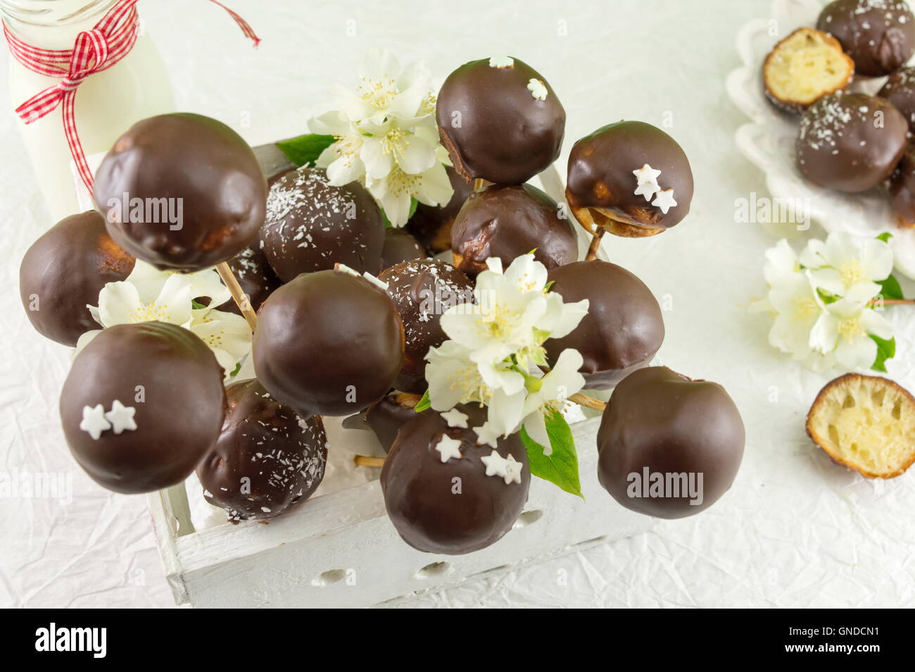 Bunch of chocolate cake pops in a wooden box Stock Photo - Alamy