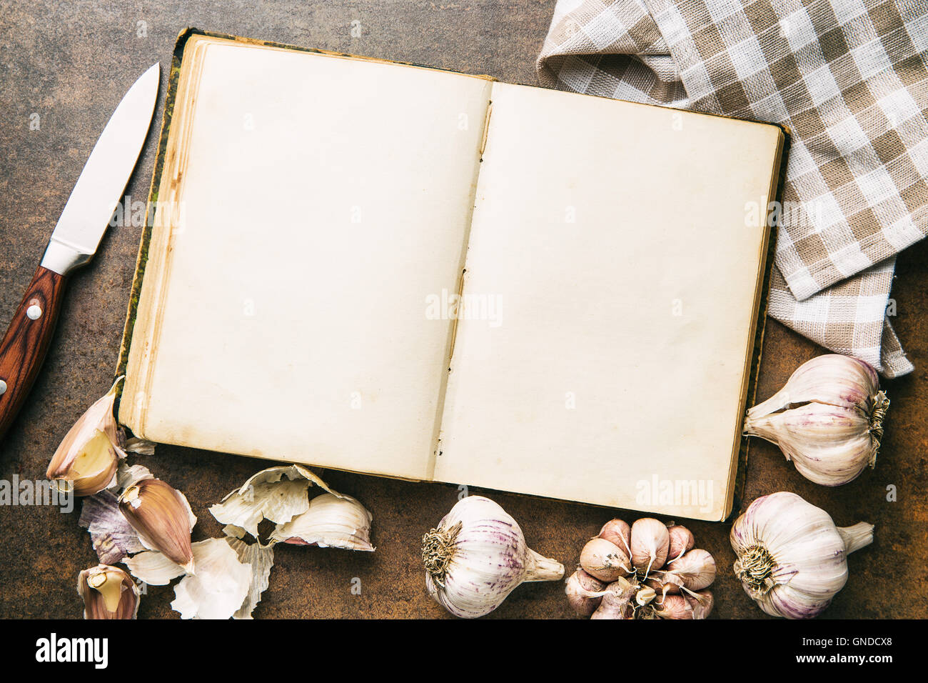 Blank cookbook and garlic. Top view Stock Photo - Alamy