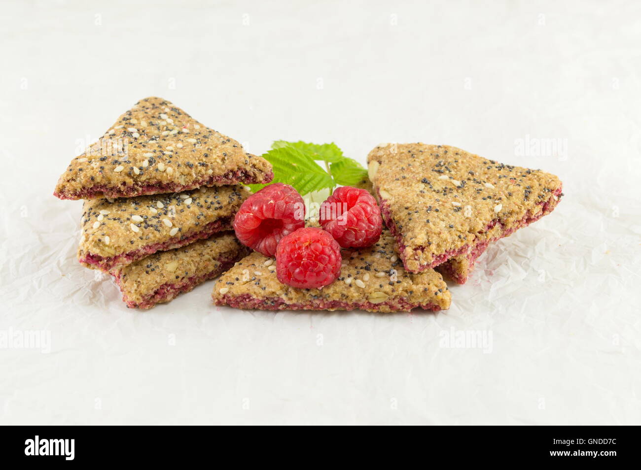 Integral triangle shaped biscuits with fresh raspberry fruit Stock ...