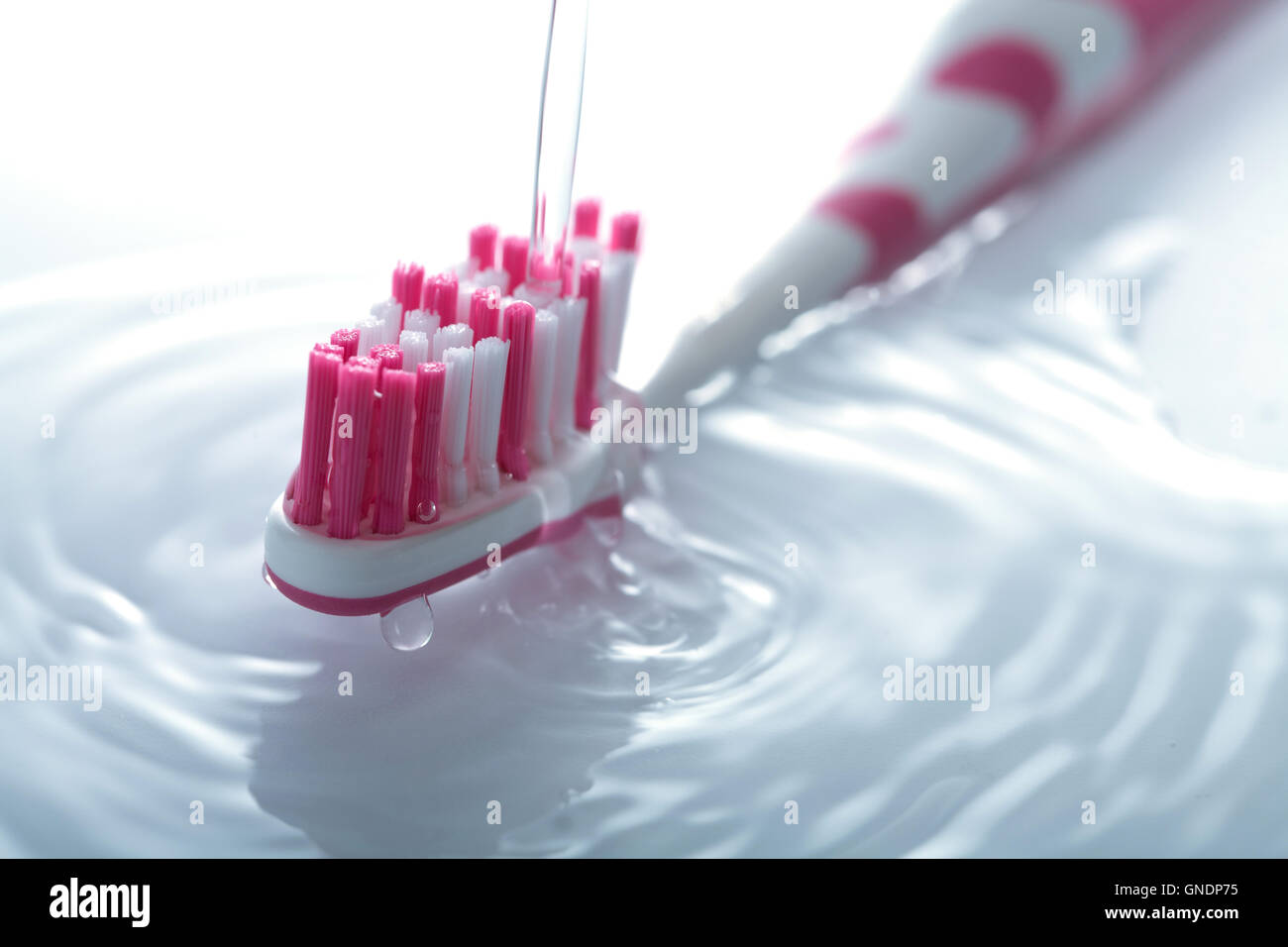 water splashing over toothbrush Stock Photo - Alamy