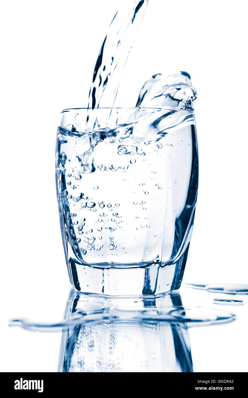 water splashing into glass isolated Stock Photo - Alamy