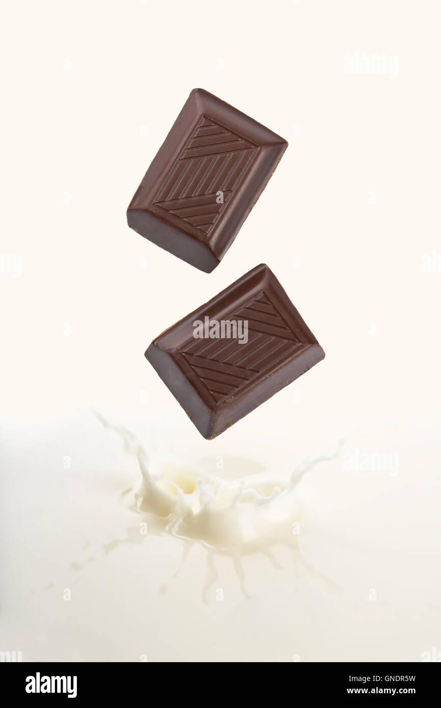 chocolate falling into milk Stock Photo - Alamy