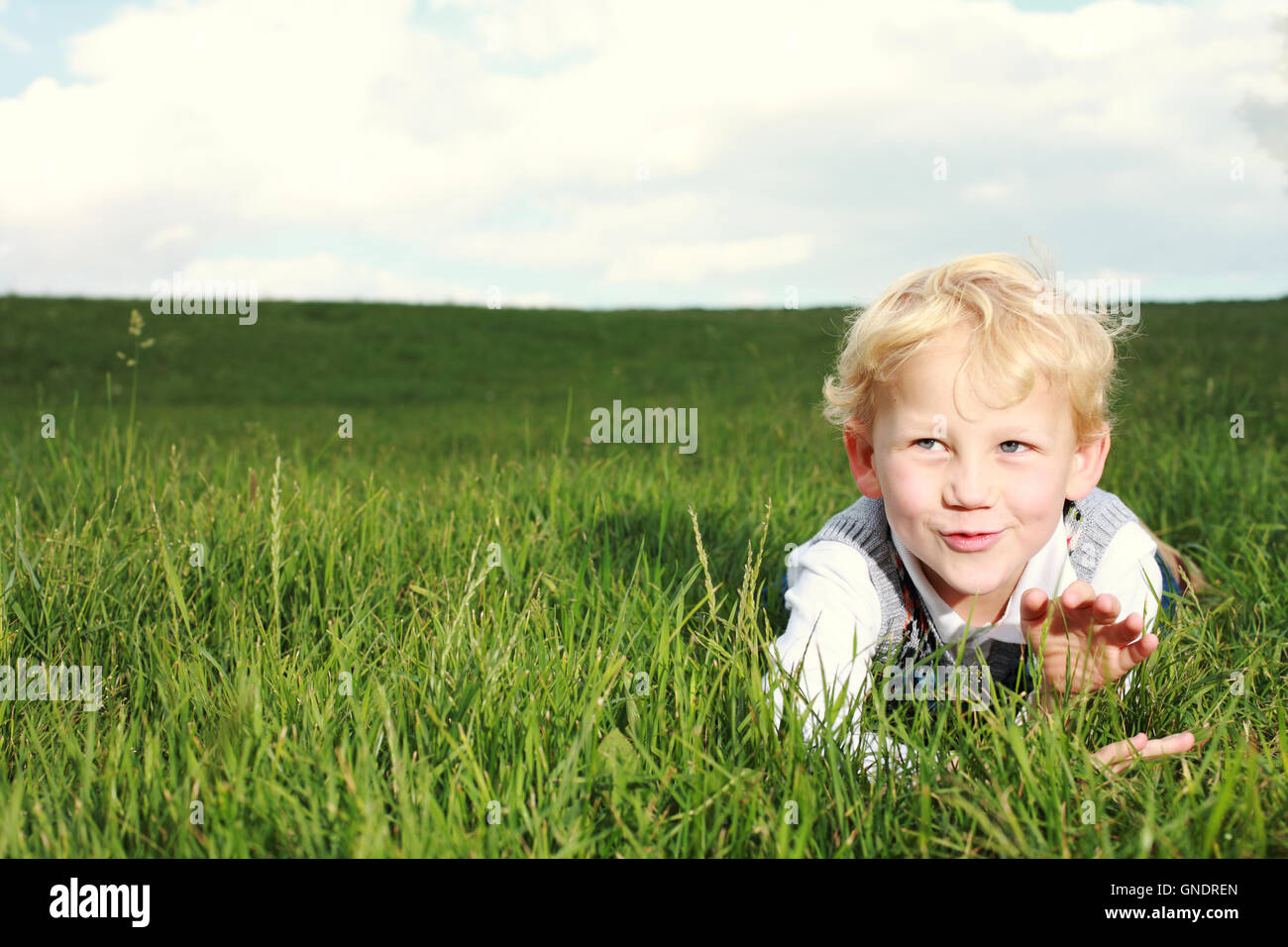 Happy little boy showing appreciation Stock Photo - Alamy