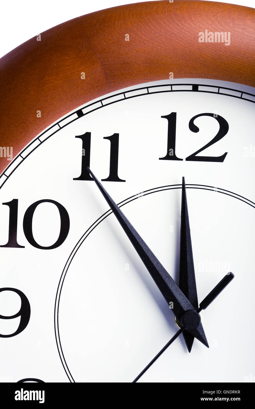round clock showing time about twelve isolated Stock Photo - Alamy