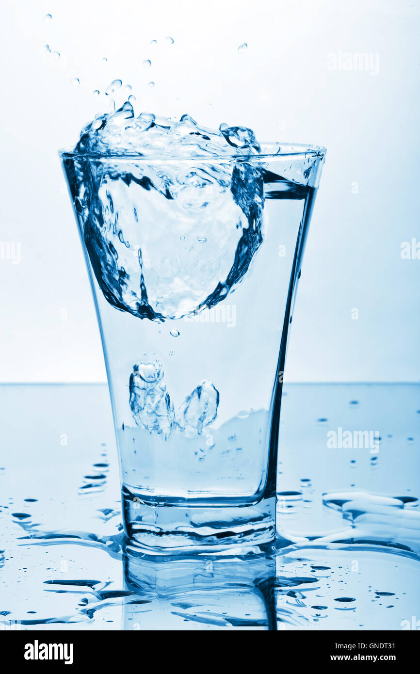 water splashing into glass Stock Photo - Alamy