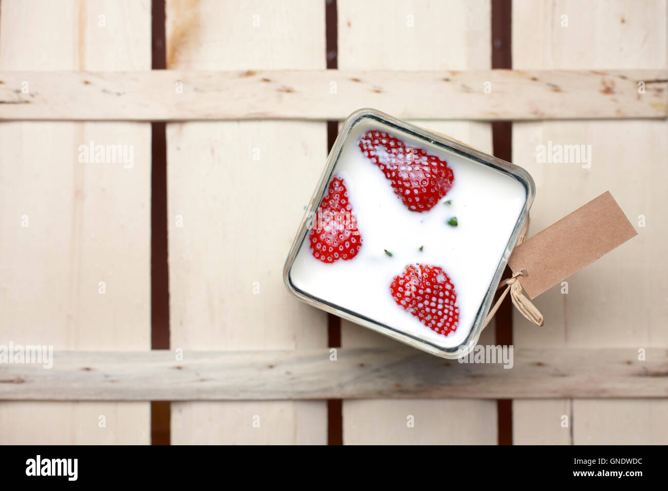 Strawberries floating in milk Stock Photo - Alamy