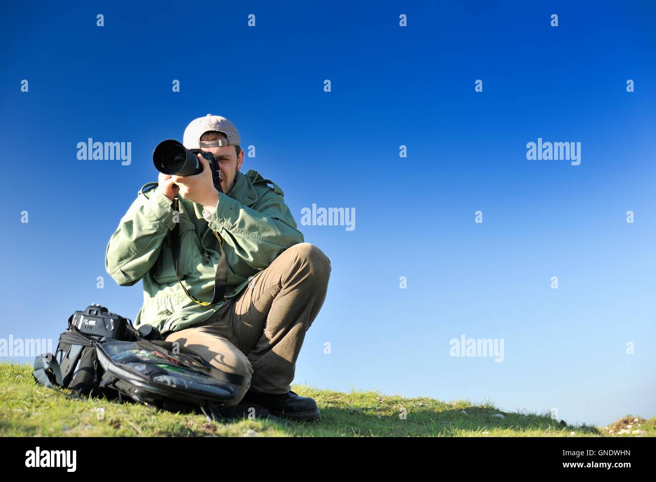 Nature photographer with digital camera Stock Photo - Alamy