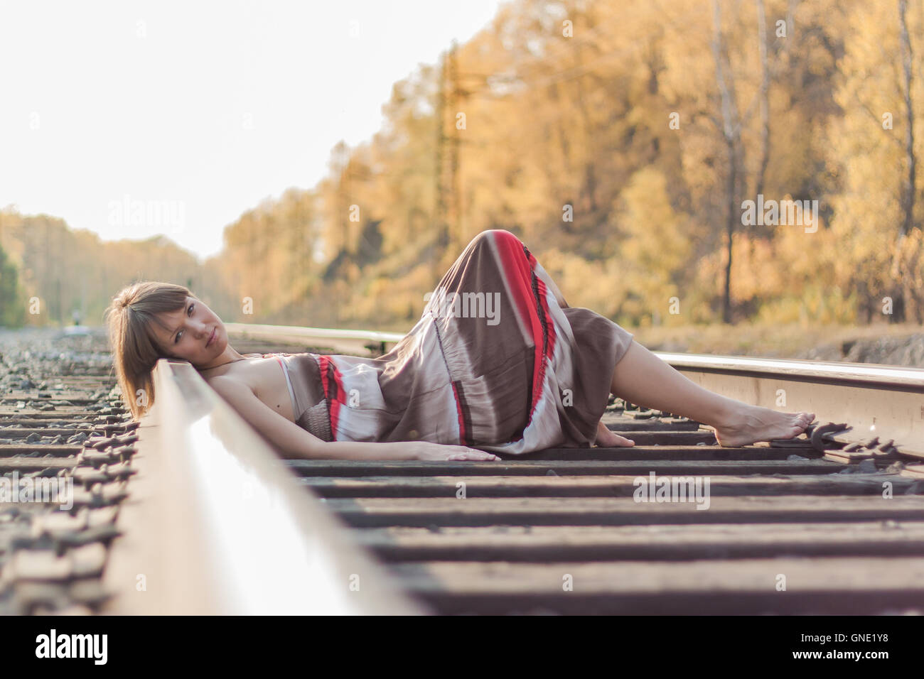 Girl laying on railroad hi-res stock photography and images - Alamy