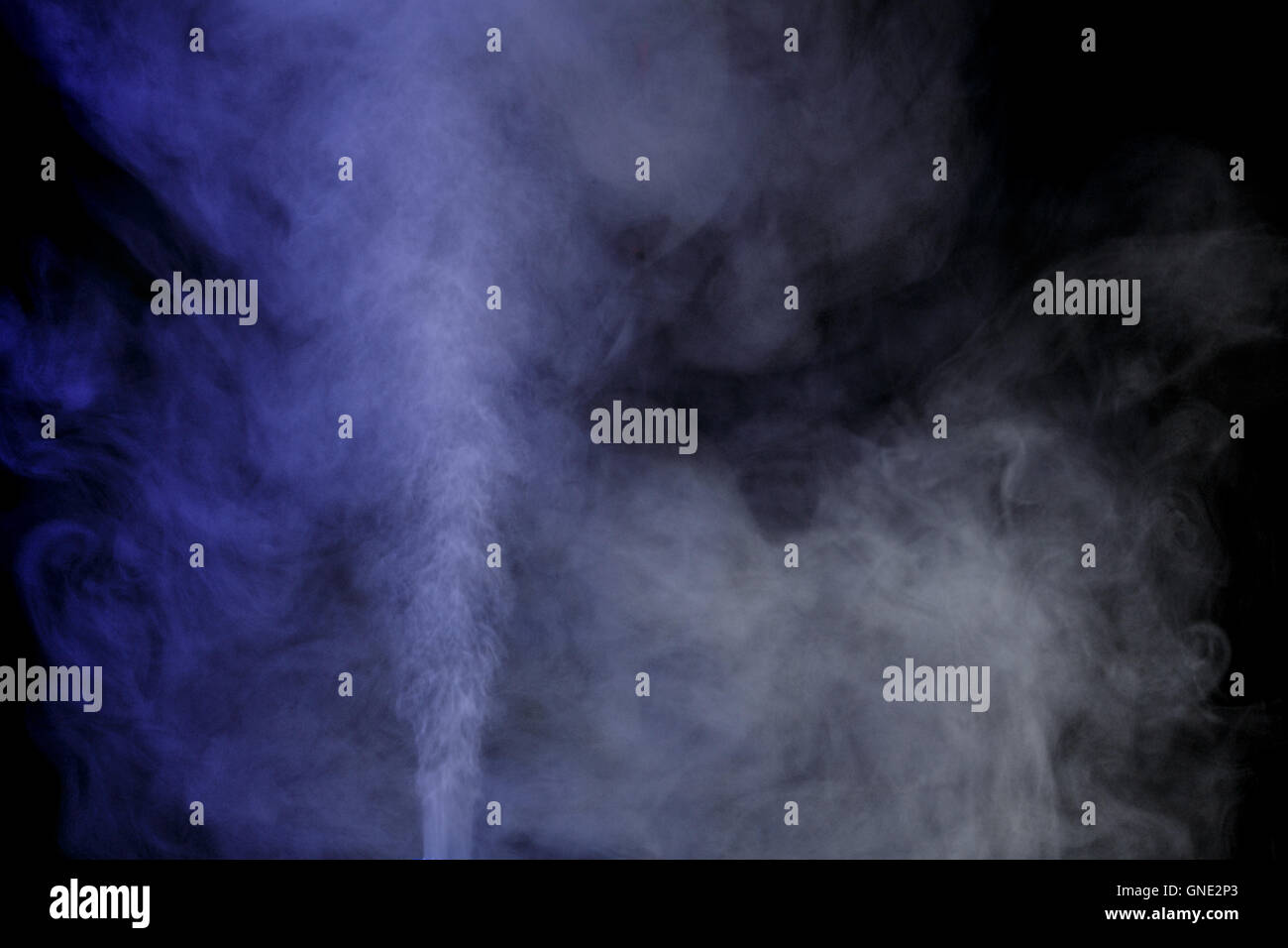 Abstract blue water vapor on a black background. Texture. Design ...
