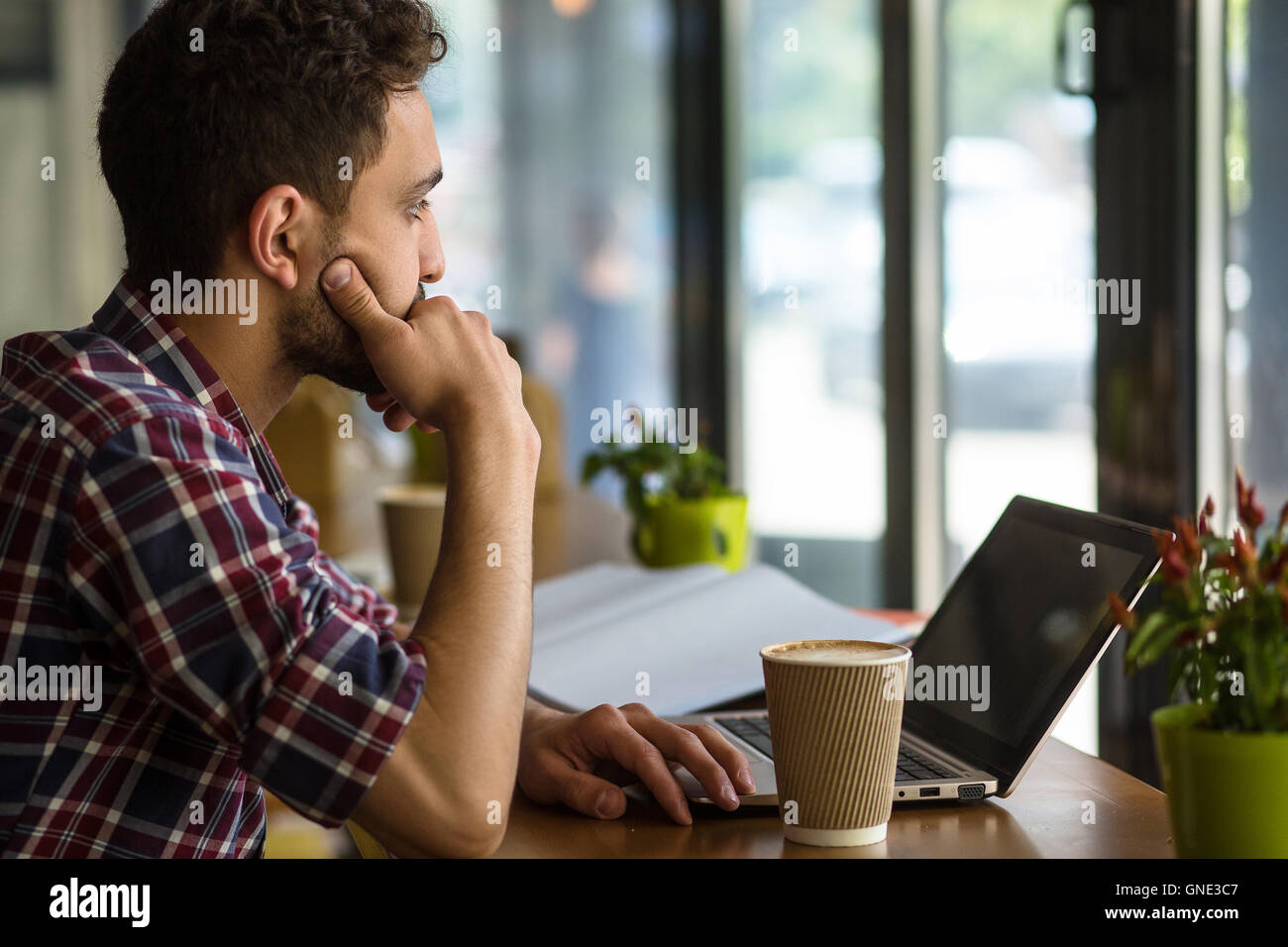 Handsome man working in restaurant Stock Photo - Alamy