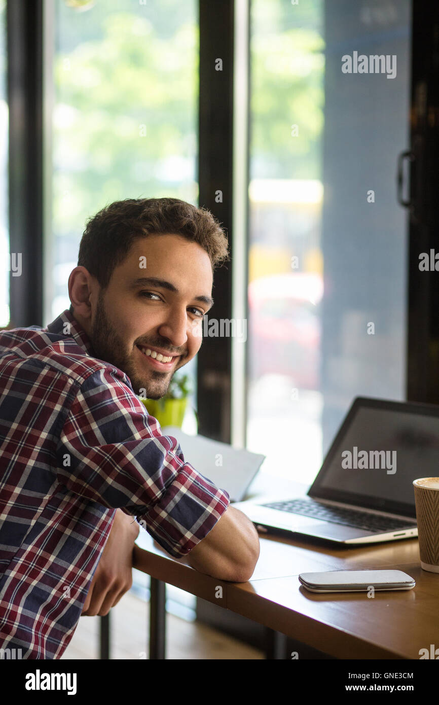Handsome man working in restaurant Stock Photo - Alamy