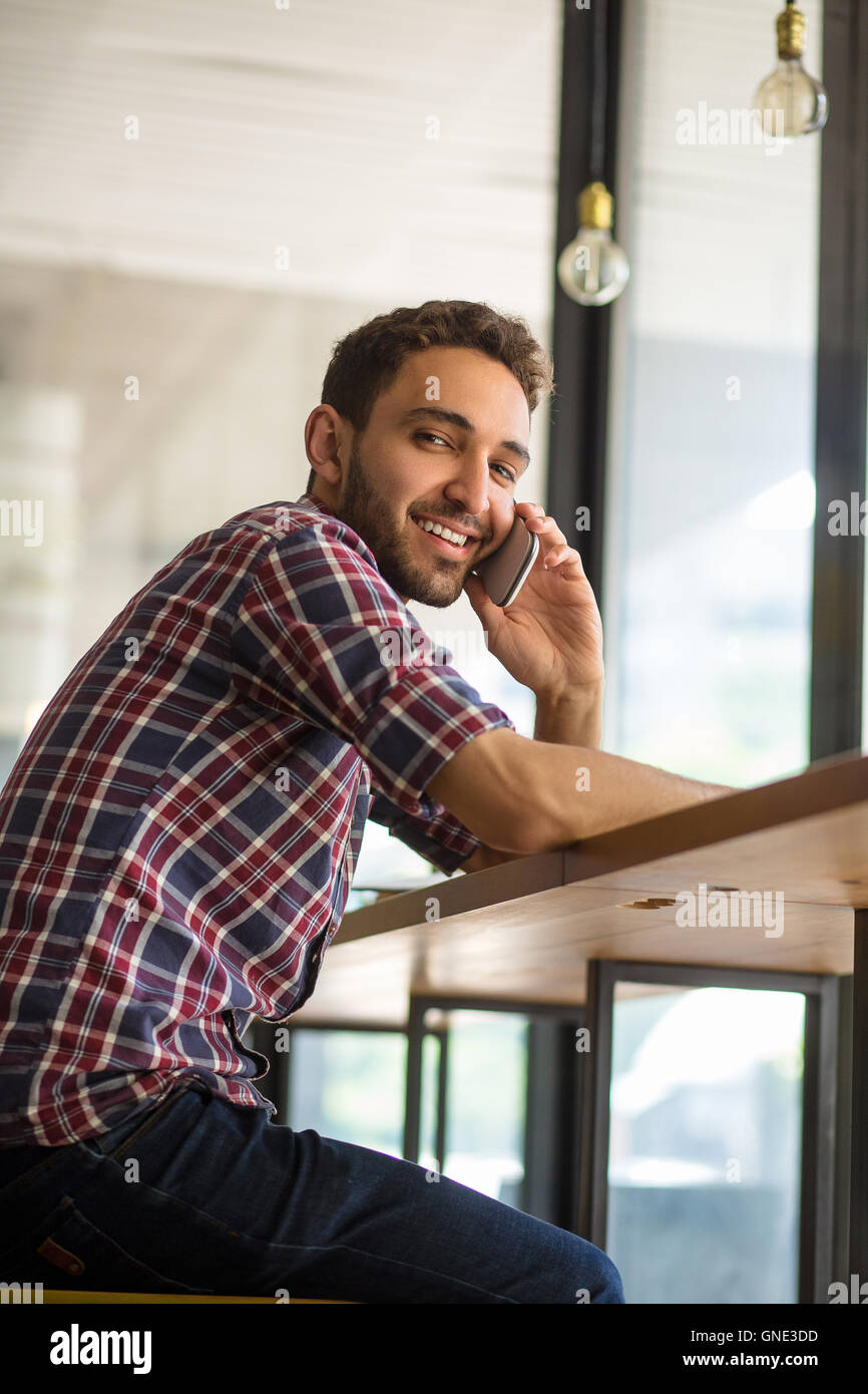 Handsome man working in restaurant Stock Photo - Alamy
