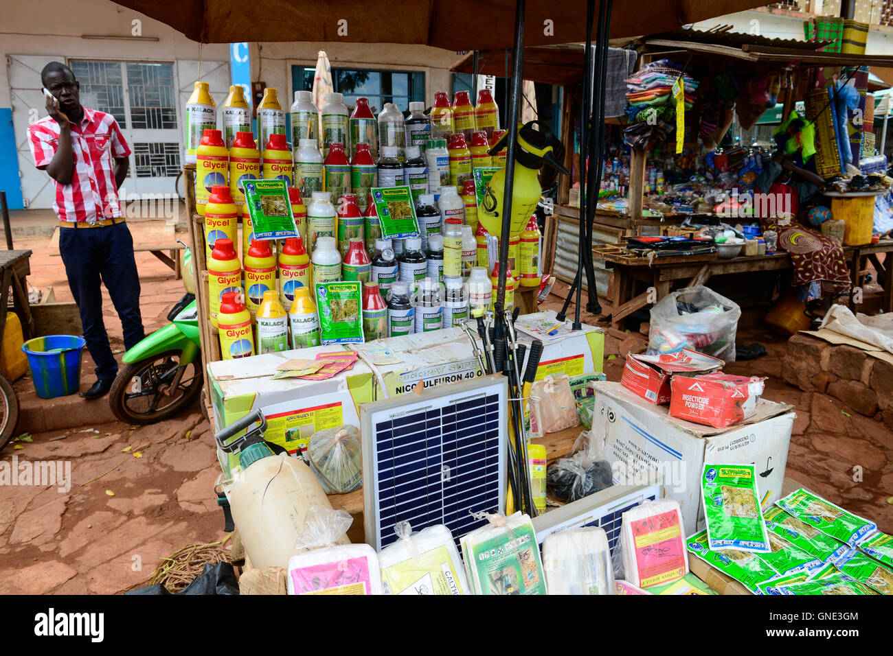 BURKINA FASO, Bobo Dioulasso, market booth for sale of pesticides ...