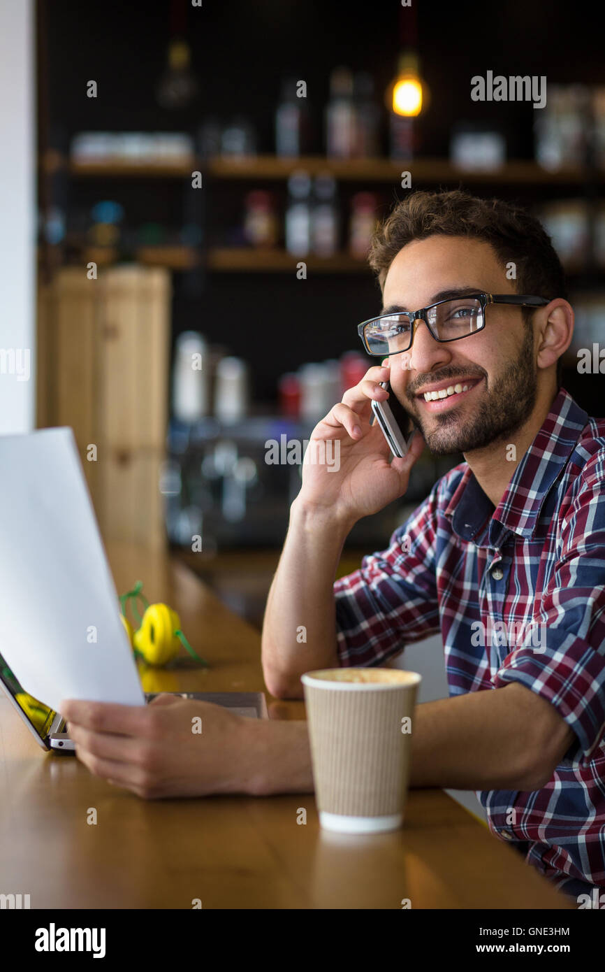 Handsome freelance man working Stock Photo - Alamy