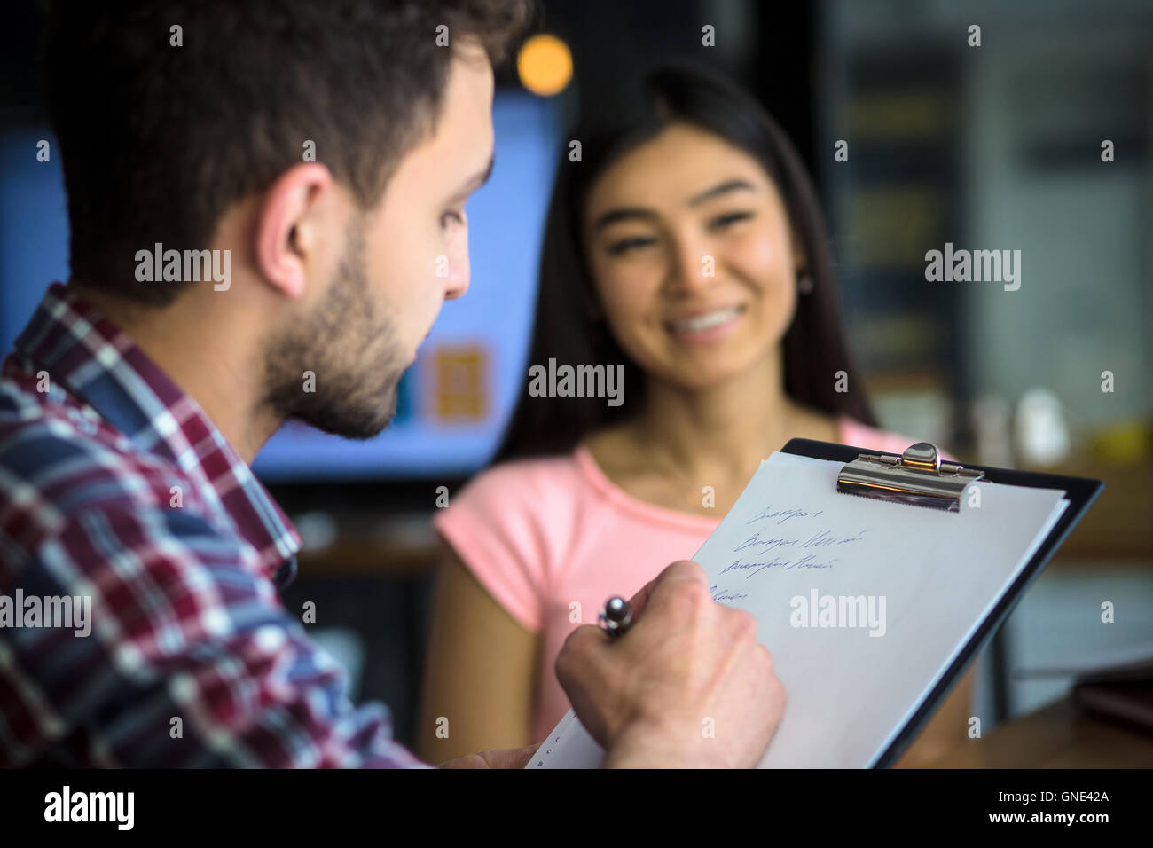 Beautiful lady having interview in restaurant Stock Photo - Alamy