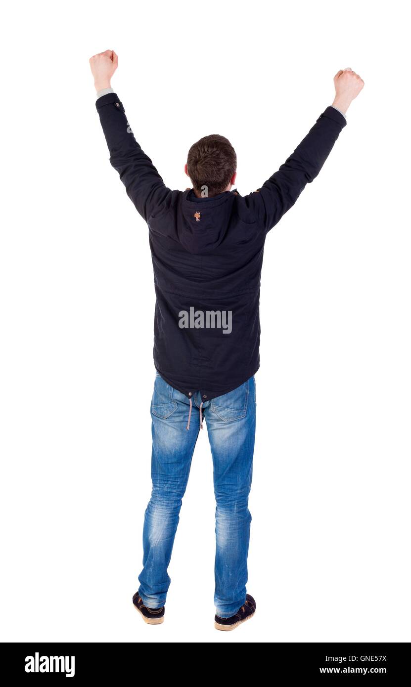 Back view of man. Raised his fist up in victory sign Stock Photo - Alamy
